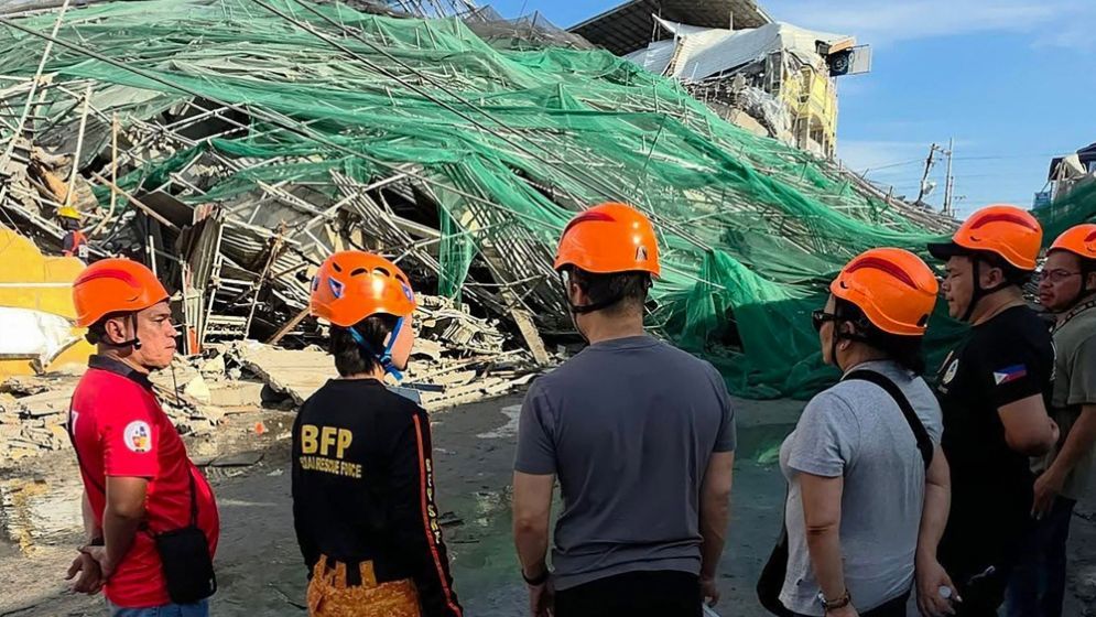 Rescuers search for over 20 trapped after Philippines building collapse