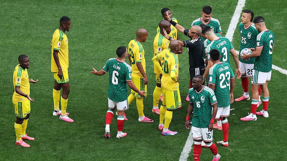 Why footballers wearing pink boots at FIFA World Cup?
